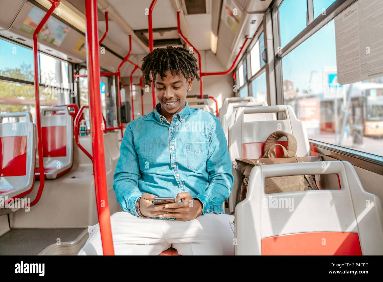 Sitting in bus hi-res stock photography and images - Alamy