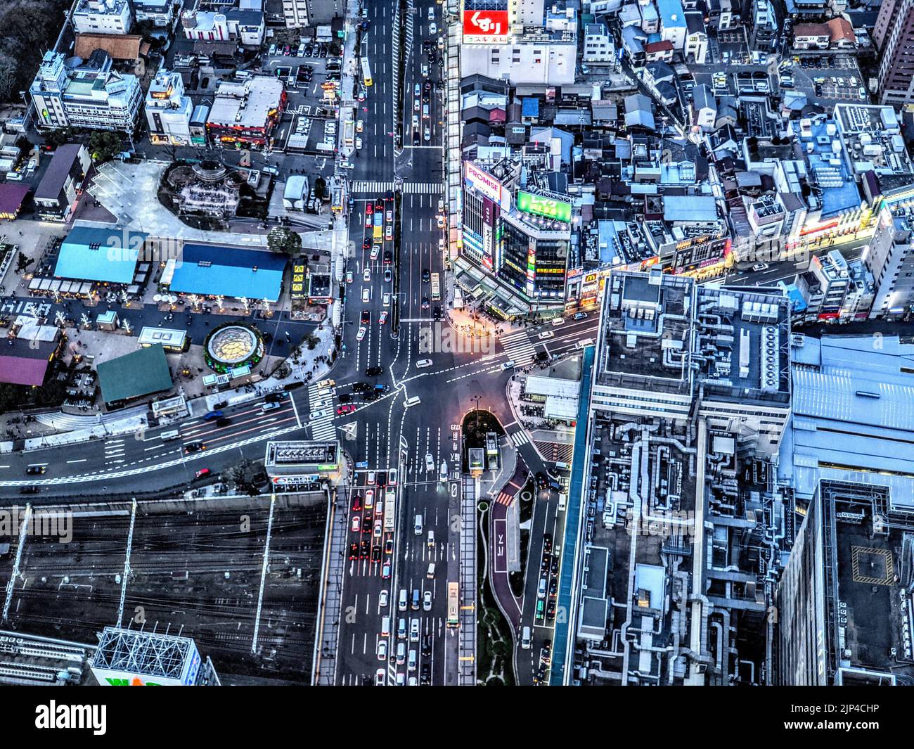 An aerial shot of the Osaka city with busy streets in the evening in ...