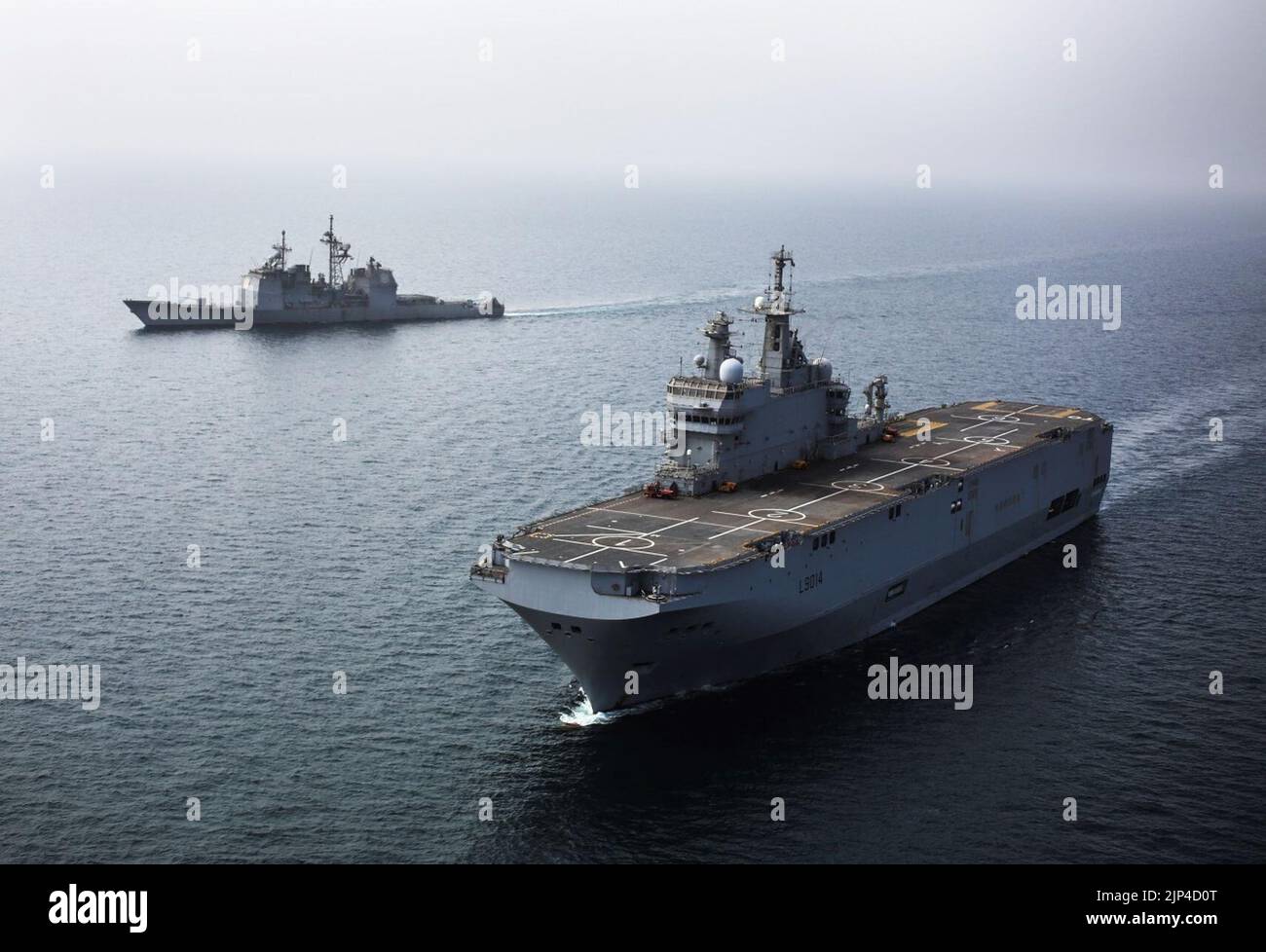 The French ship LHD Tonnerre and USS Monterey patrol the open seas ...