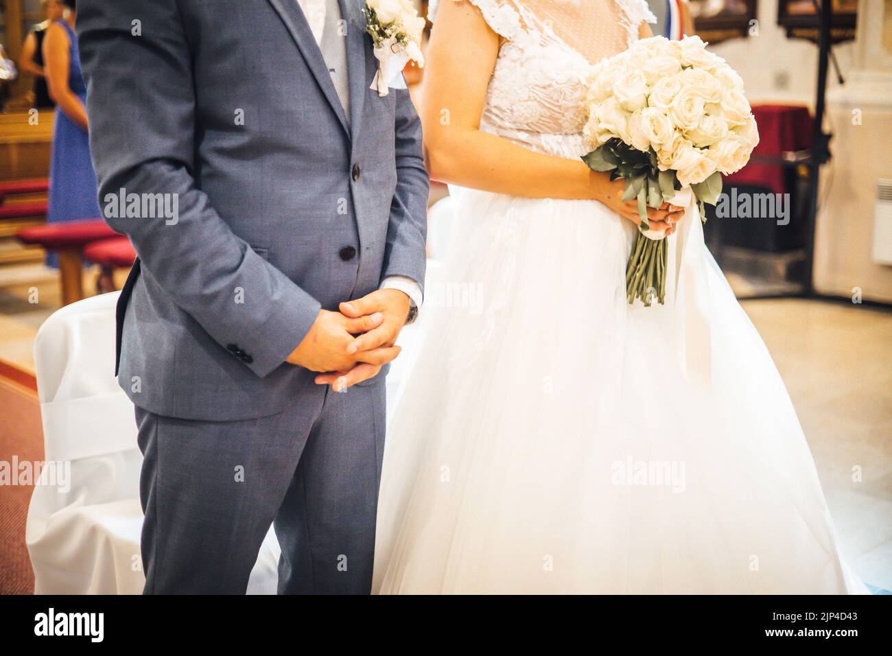 An anonymous groom standing by his bride while the wedding Stock Photo ...