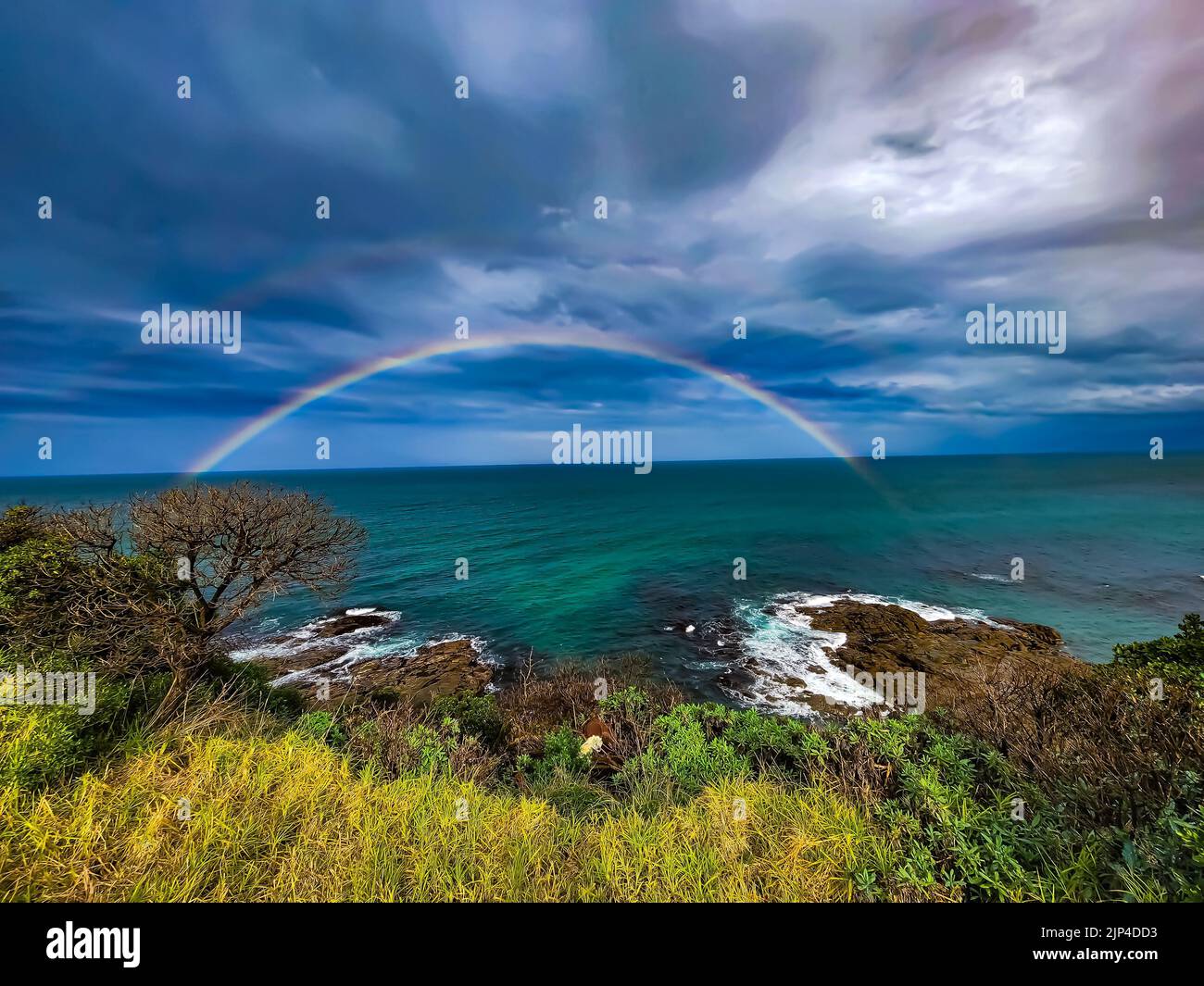 Double rainbow over the clear ocean waters Stock Photo - Alamy