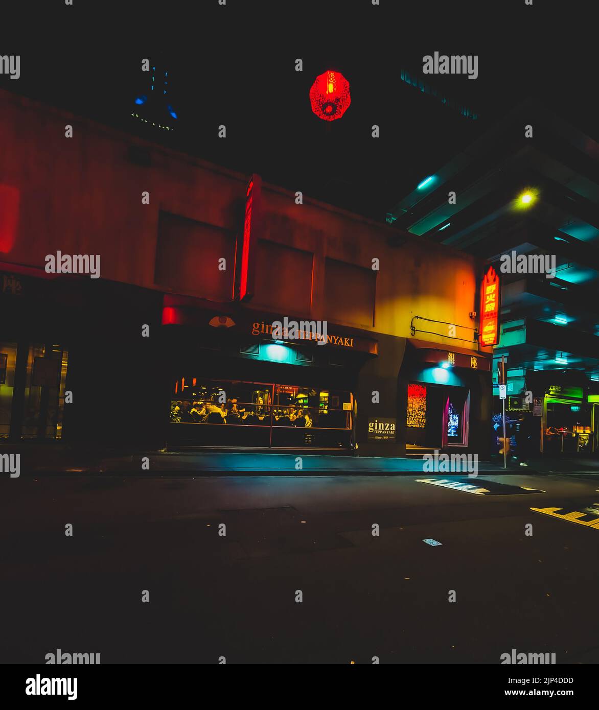 Neon lights of the city in an alleyway late at night Stock Photo - Alamy