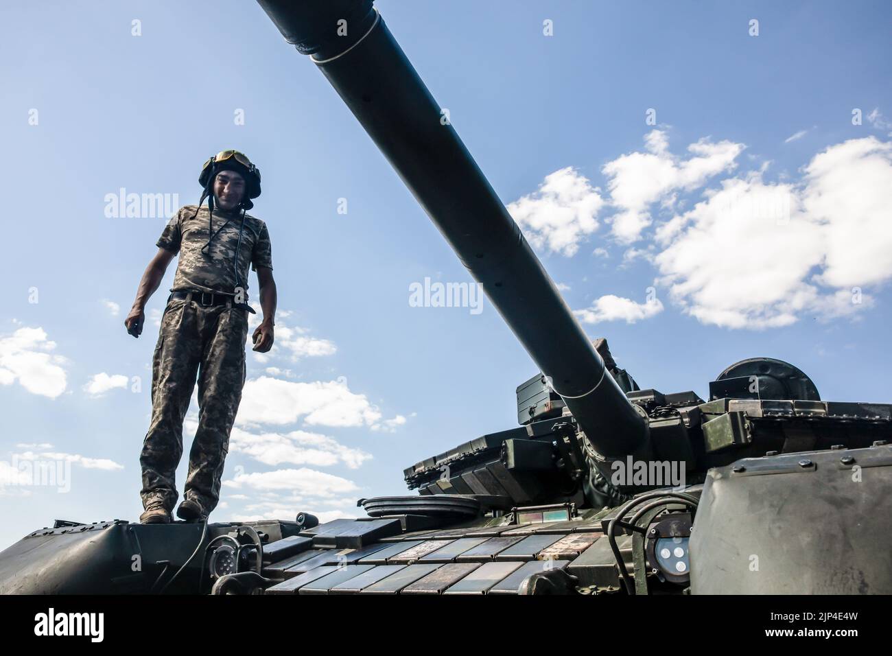 A Ukrainian Armed Forces tanker stands on a tank turret. Defense line ...