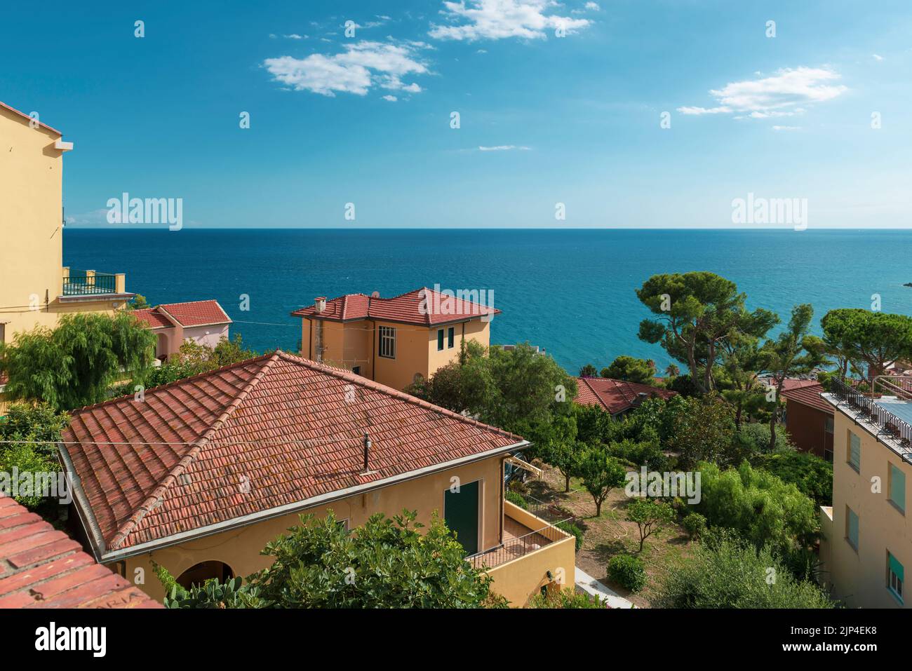 Sunny mediterranian town with deep blue sky and sea on the background ...