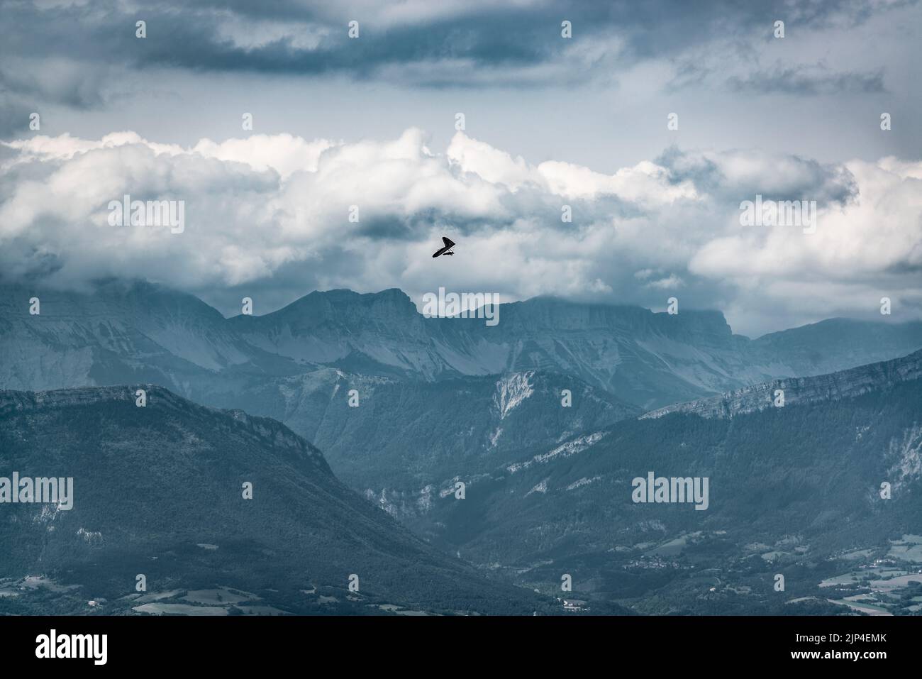 Hang glider in the stormy sky. Dramatic photo of extreme sport activity ...