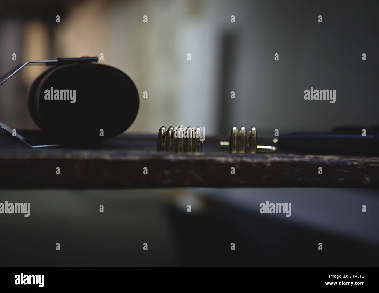 Pistol bullets and weapon magazine in an indoor shooting room Stock ...