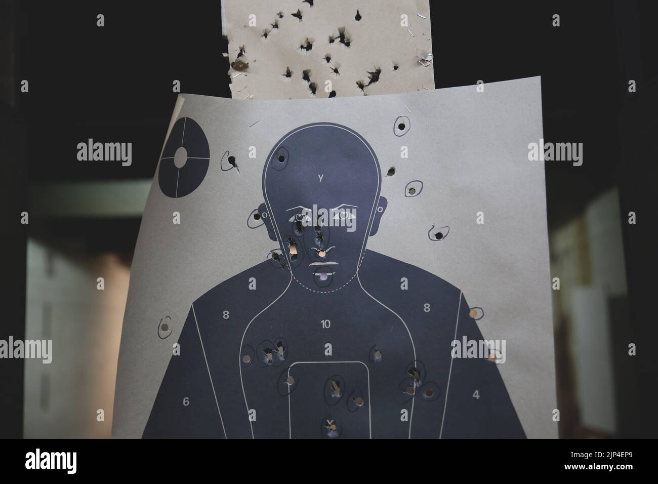 Pistol bullseye target in a shooting club Stock Photo - Alamy