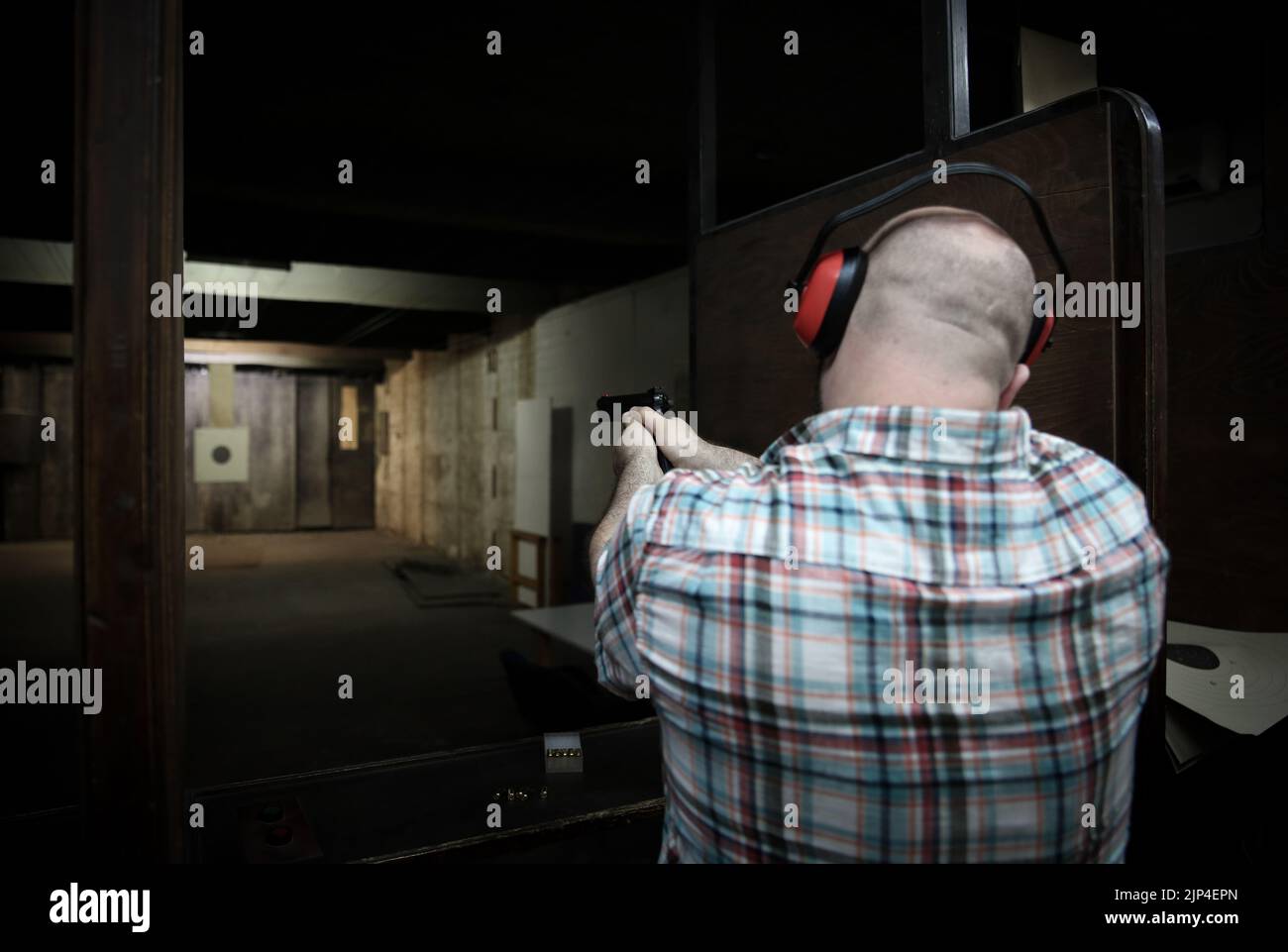 Pistol bullseye target training in a shooting room Stock Photo - Alamy