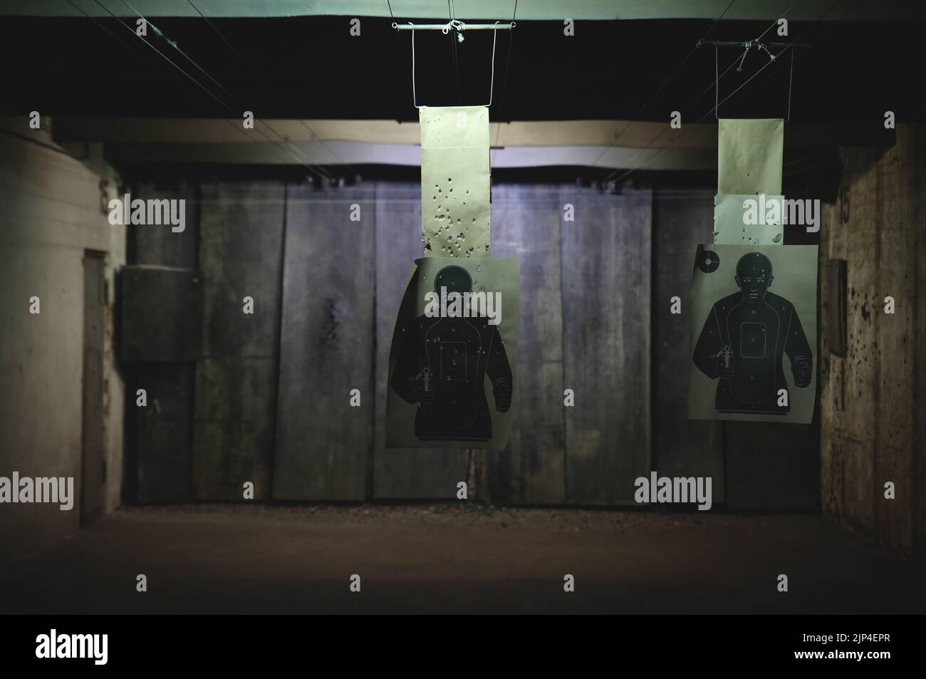 Weapon Bullseye target training in a shooting club Stock Photo - Alamy