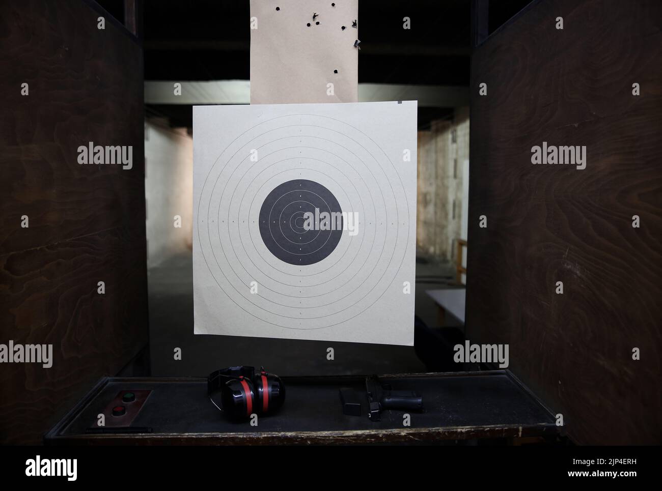 Pistol bullseye target training in a shooting club Stock Photo - Alamy