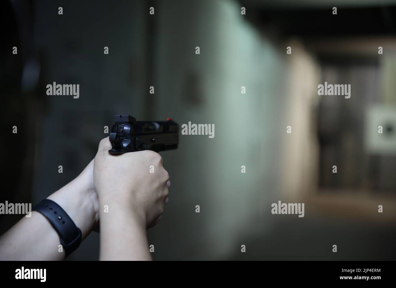 Woman Weapon bullseye target training in a shooting club Stock Photo ...