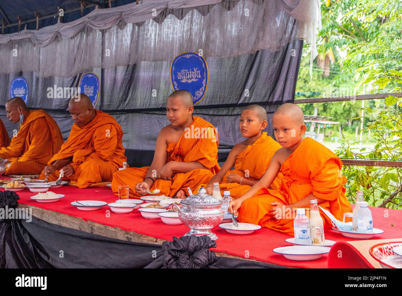 Food offering or food donation to Thai monks as part of a religious and ...