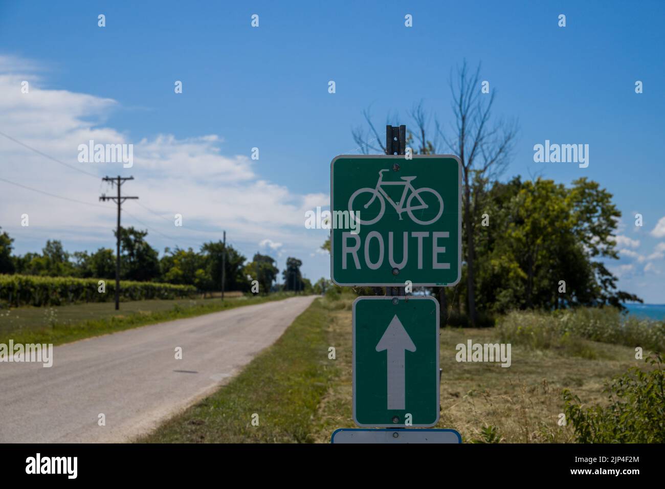 Bicycle road sign. Waterfront walking tourist road. Bike route ...