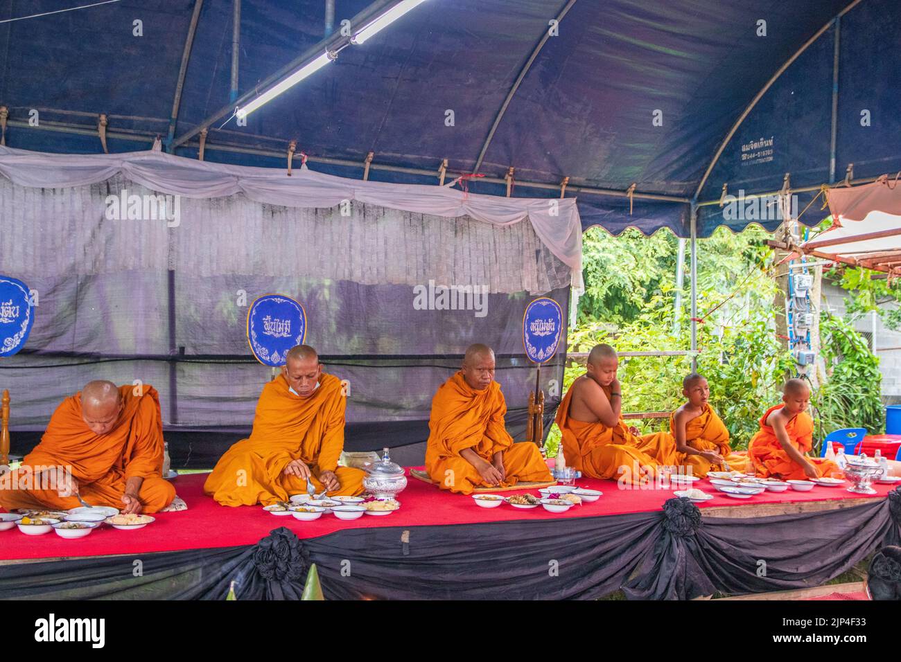 Food offering or food donation to Thai monks as part of a religious and ...