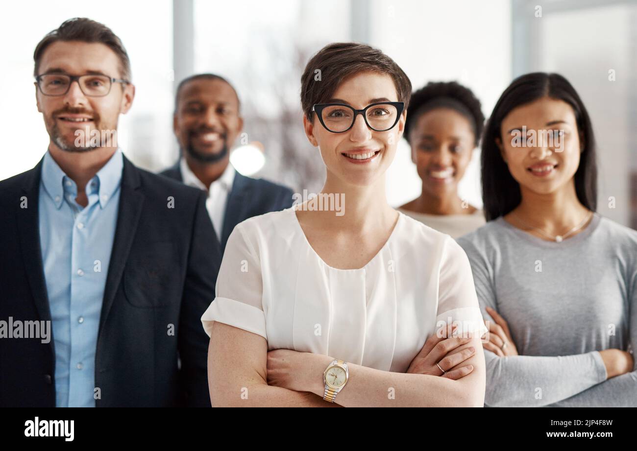 Smiling and modern team of business workers happy about teamwork ...