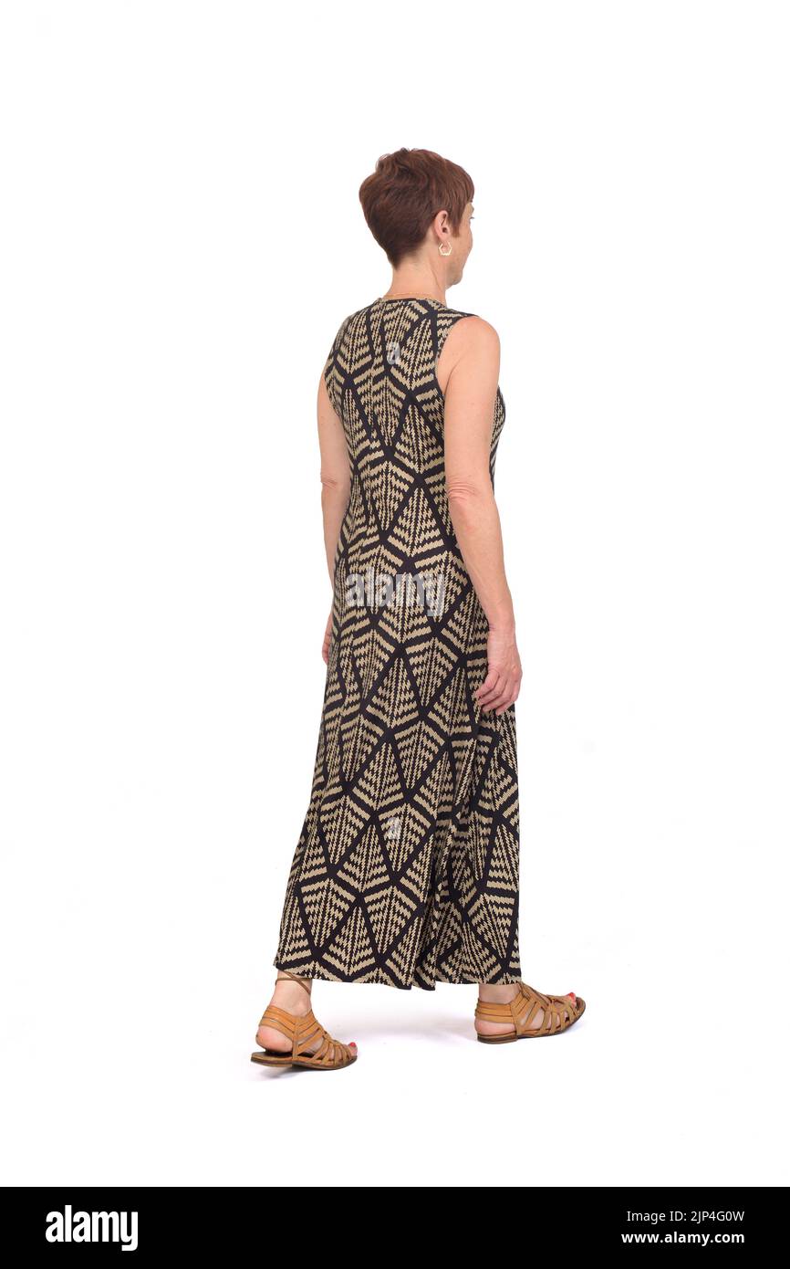 back and side view of a middle aged woman walking on white background ...