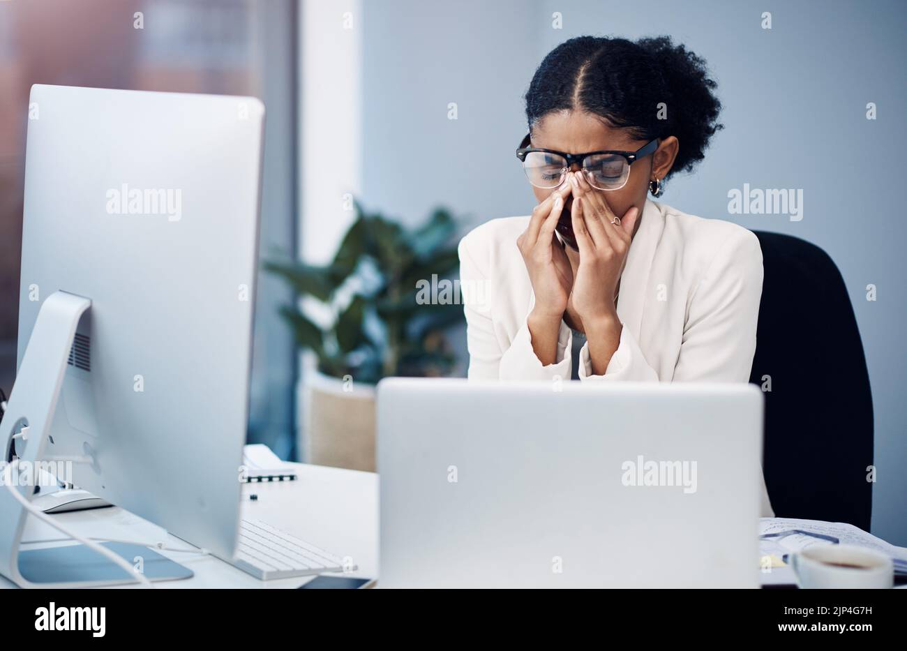 Nothing is worth this. a young businesswoman looking stressed at her ...