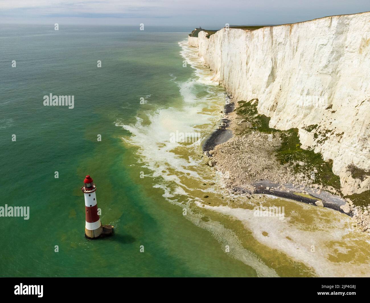 An aerial view of the Beachy Head Cliffs Lighthouse on the shore Stock ...