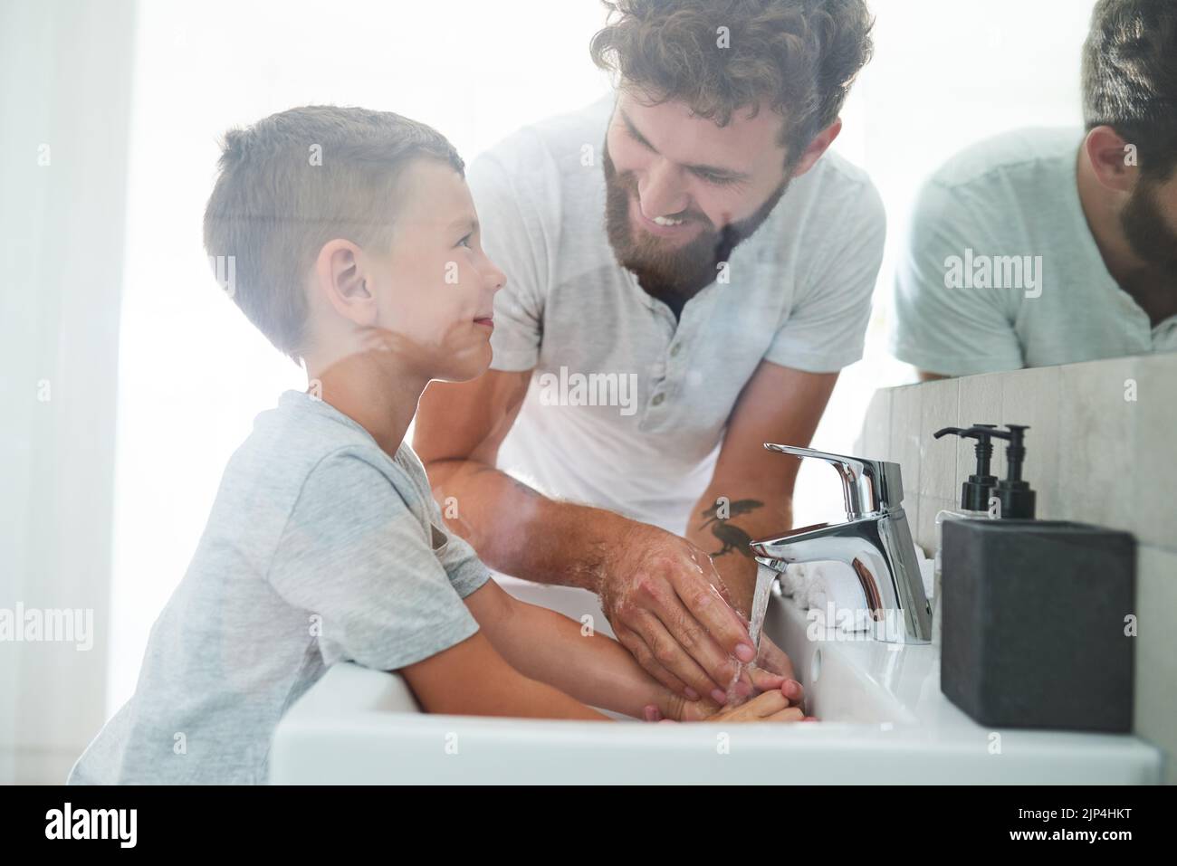 Cleanliness is important, so always wash your hands. a young handsome ...