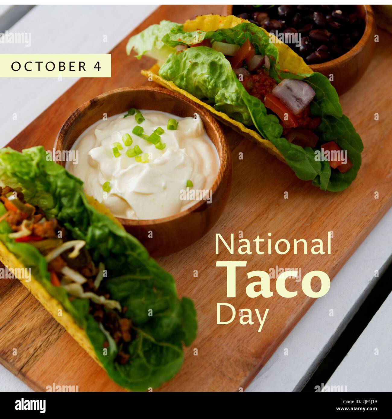 Composition of october 4 national taco day text with tacos on cutboard ...
