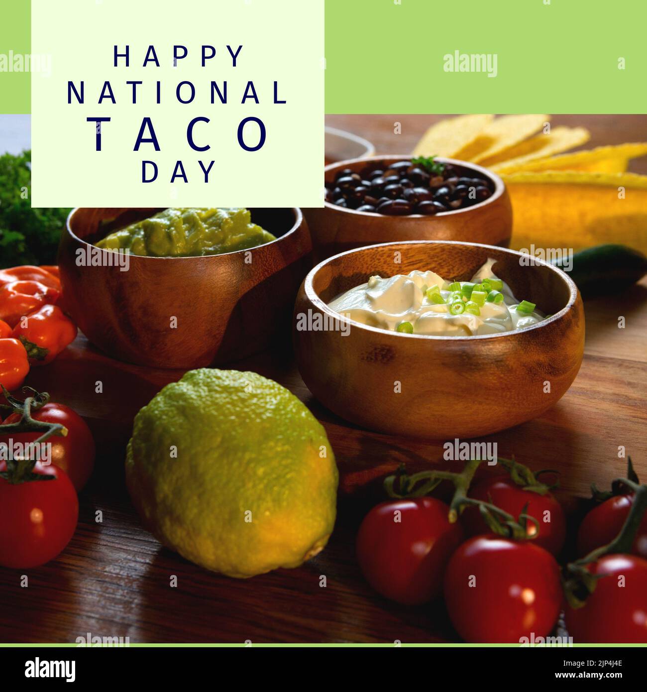 Composition of happy national taco day text with tacos on table ...