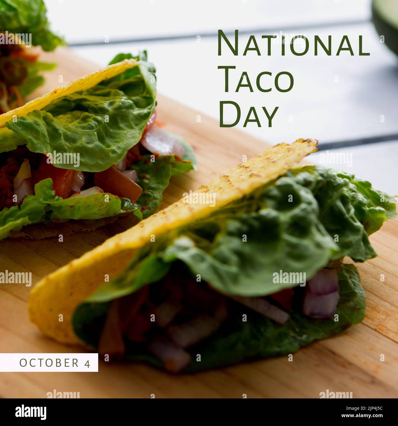 Composition of october 4 national taco day text with tacos on cutboard ...