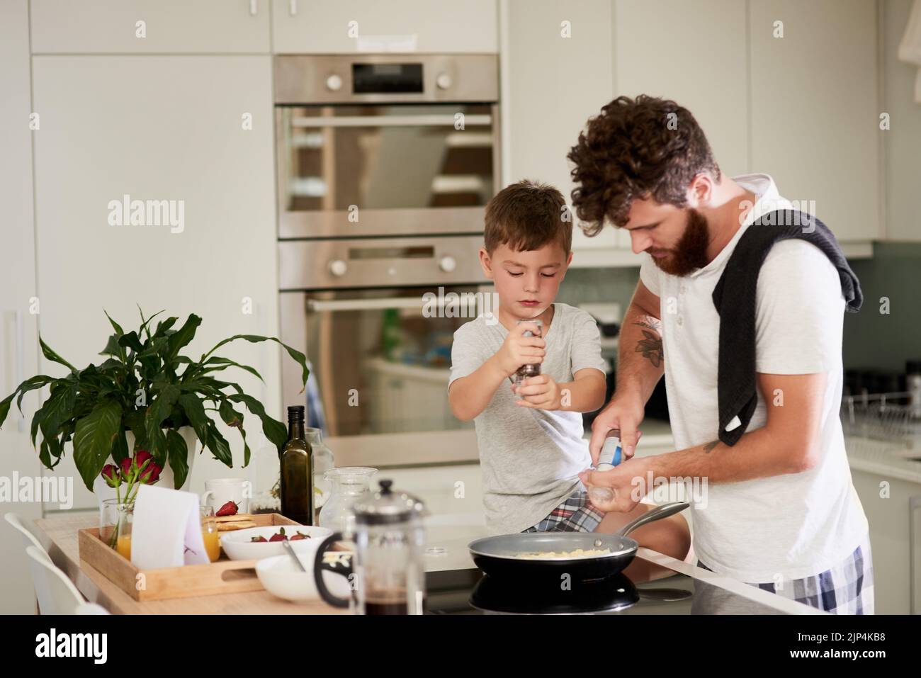 Master chefs in the making. an adorable little boy and his father ...