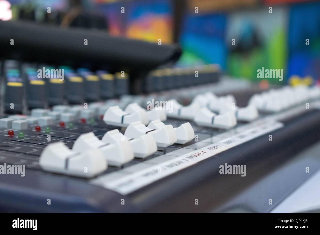 A sound engineering with sliding buttons in the studio Stock Photo - Alamy