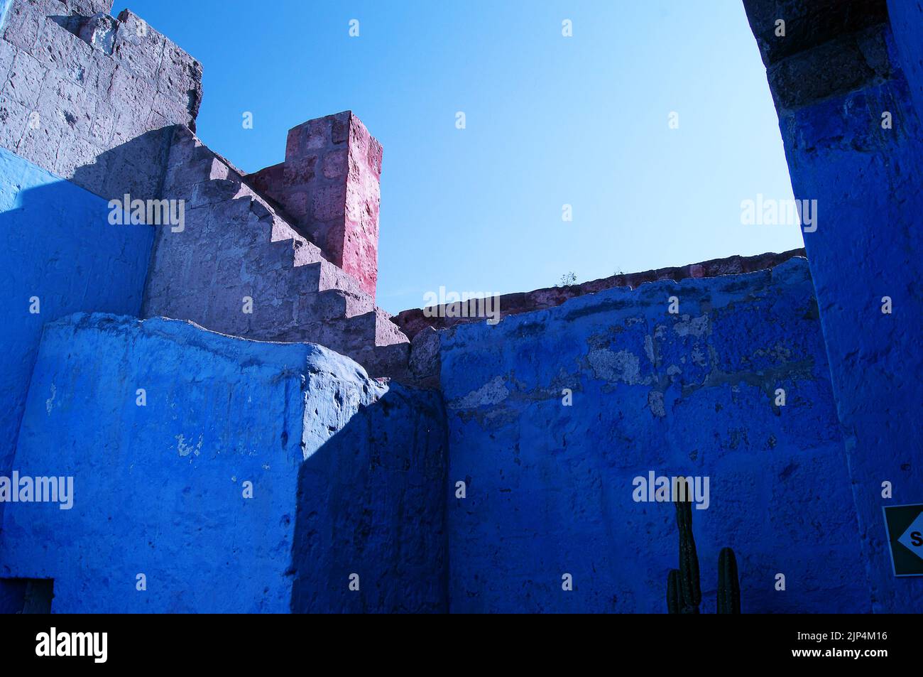 An old beautiful building painted in blue with a fence in Peru, Lima ...