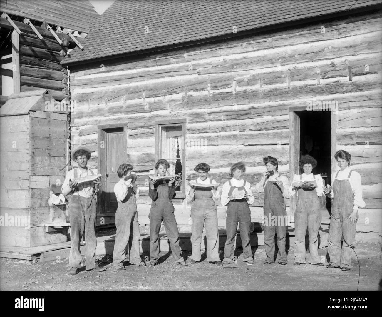 The Girls in the Overalls - The Vidal family eating watermelon Stock ...