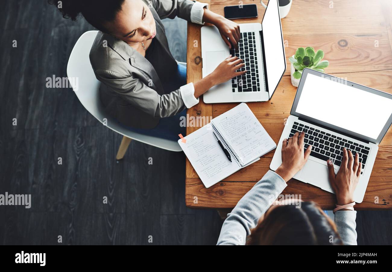 Above view of professional employees talking and working together on a ...