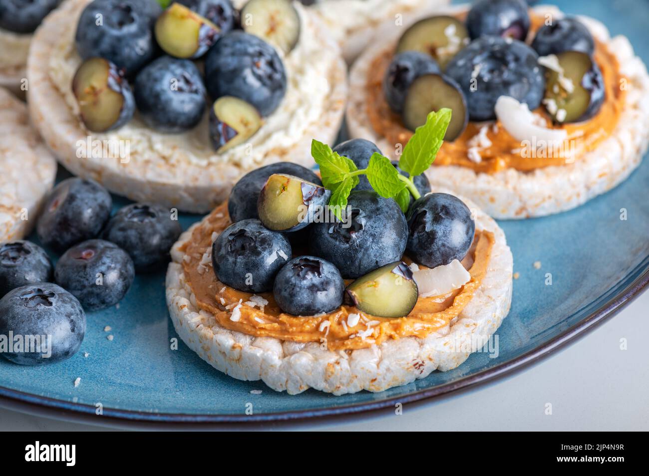 Healthy open sandwiches with blueberries Stock Photo - Alamy