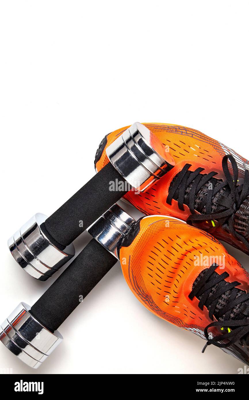 Fitness exercises at home. Metal heavy dumbbell fell on the leg in ...