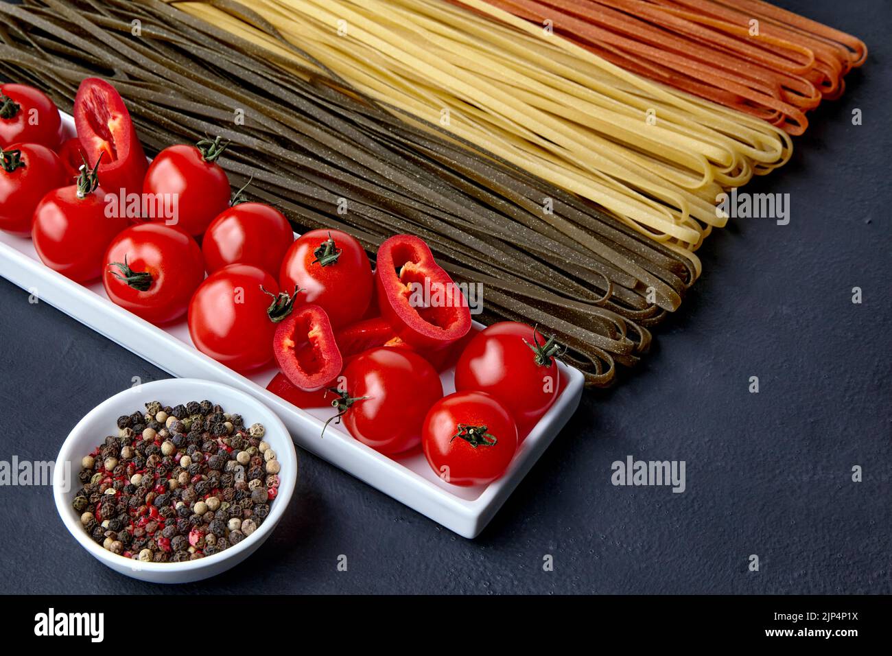 Homemade noodles in different colors from natural herbal ingredients ...