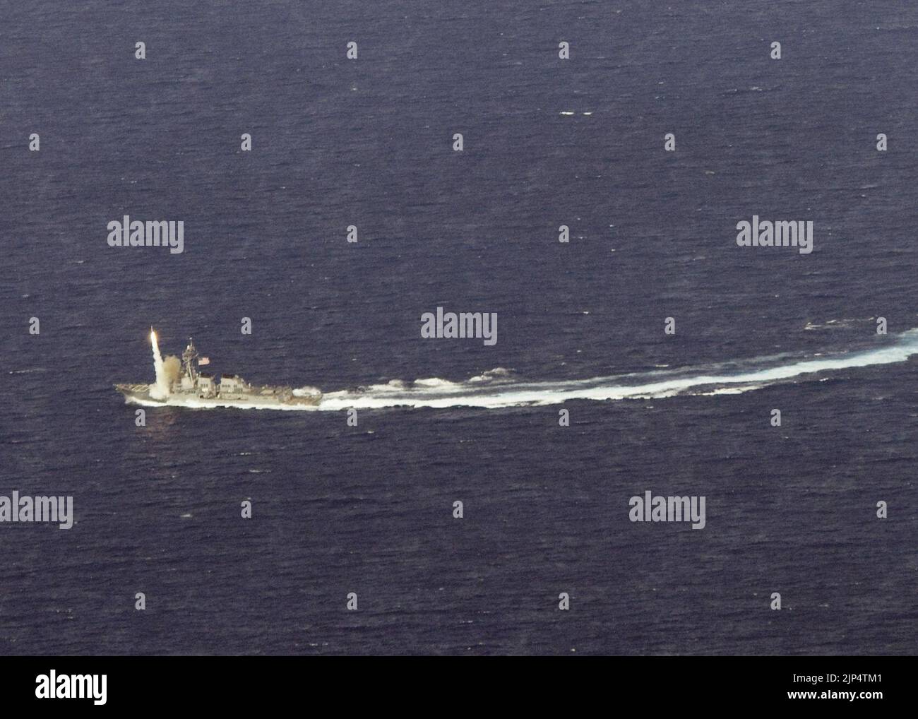 The guided-missile destroyer USS Lassen (DDG 82) launches a Standard ...