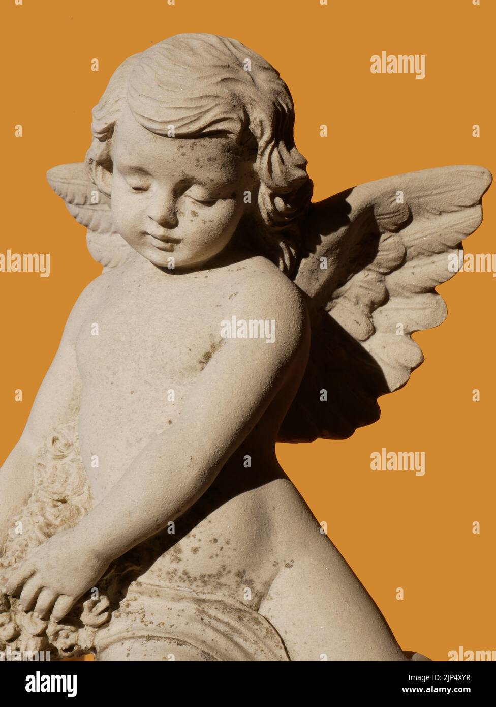 Scale reproduction of a half-length angel on an orange background Stock ...