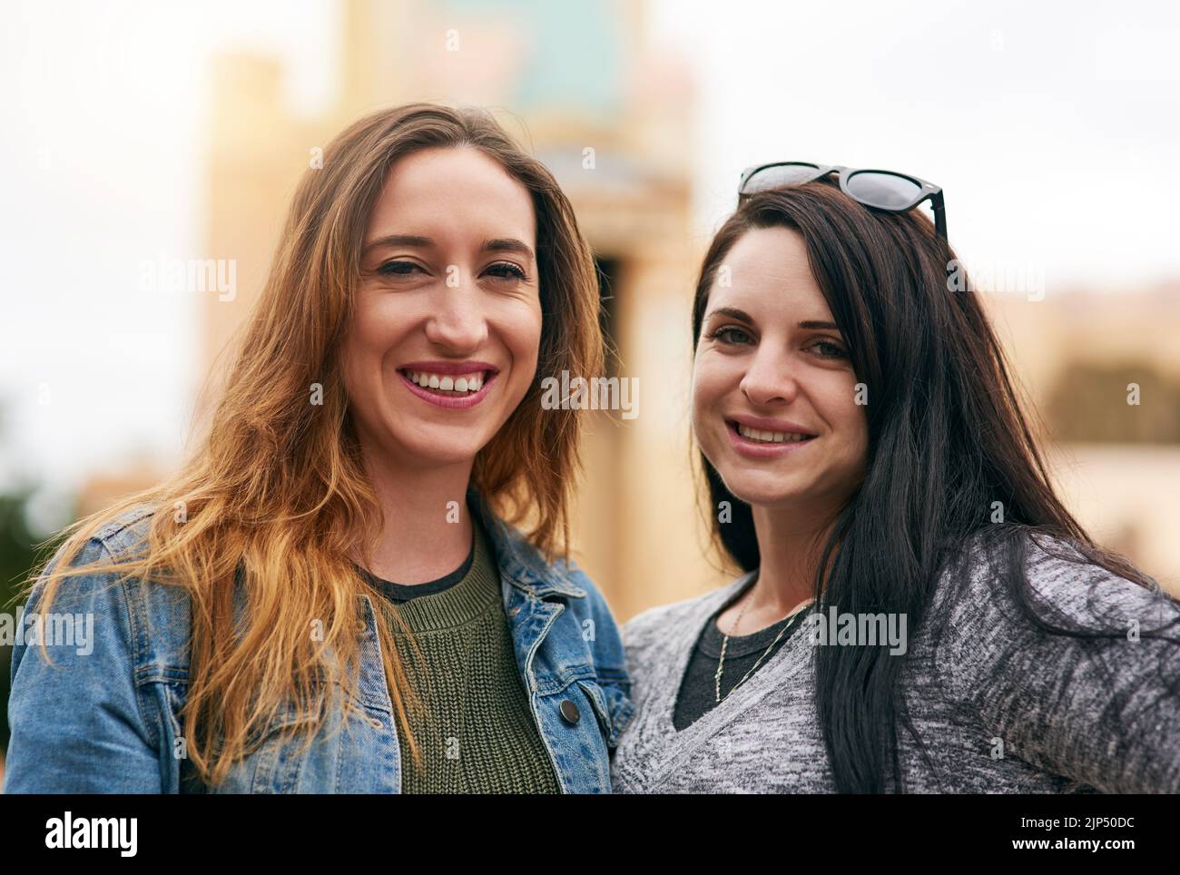 Two peas in a pod having fun out and about. Portrait of two female best ...
