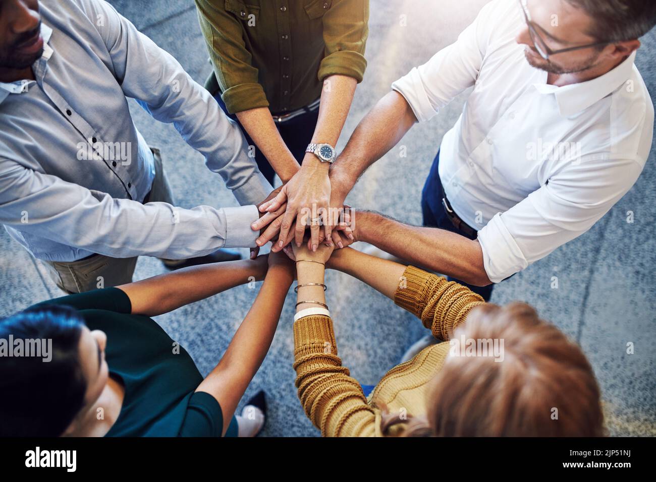 Teamwork, hands in a huddle and working together with a team or group ...