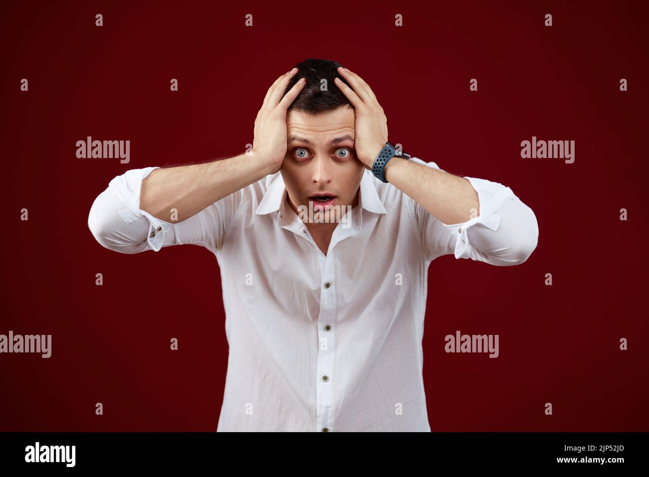shocked man with round eyes, open mouth and hands Stock Photo - Alamy