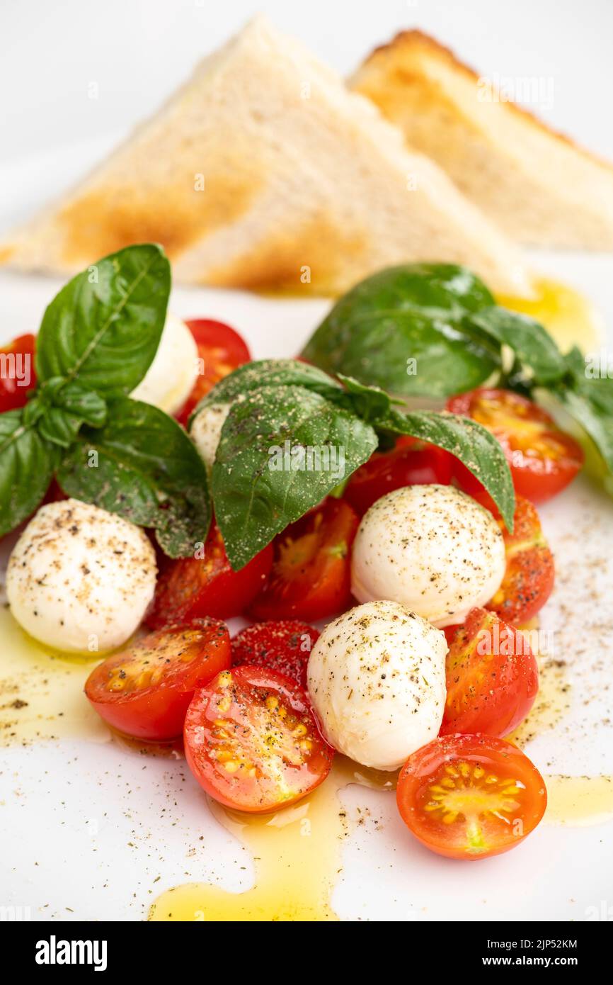 Italian insalada caprese on a white plate hi-res stock photography and ...