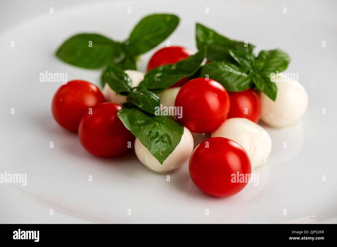 Italian insalada caprese on a white plate hi-res stock photography and ...