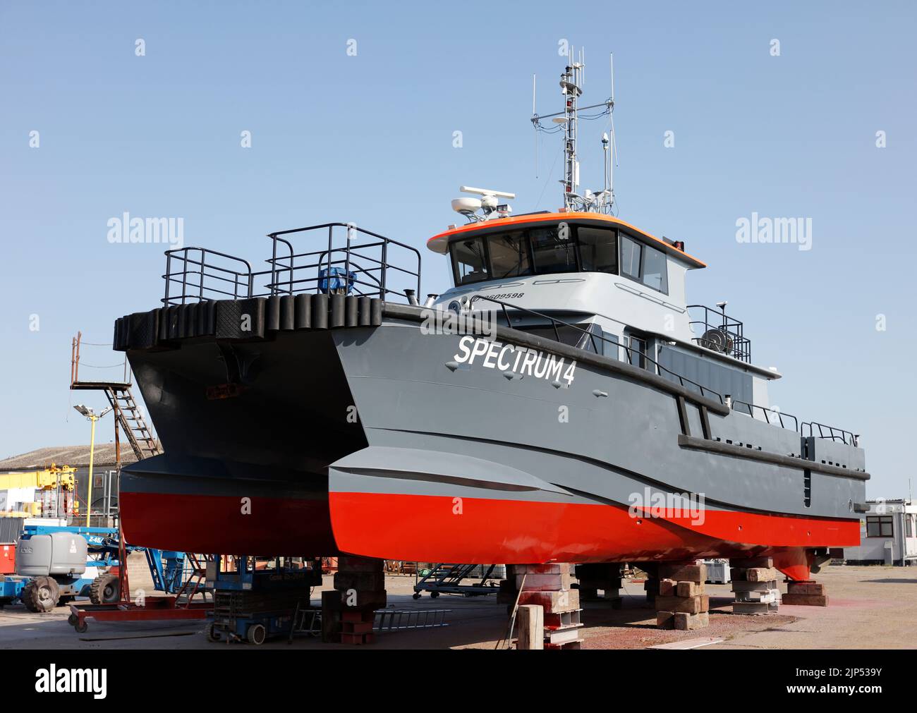 Wind farm boat out of the water for maintenace Stock Photo - Alamy