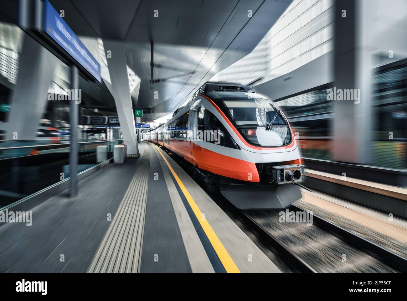 High speed train in motion inside modern train station in Vienna. Fast ...
