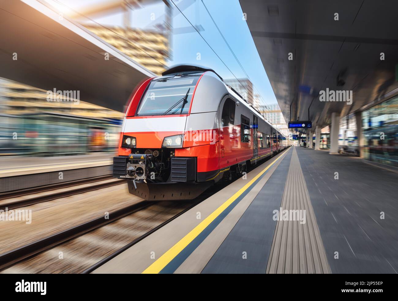 High speed train in motion on the train station at sunset in Vienna ...
