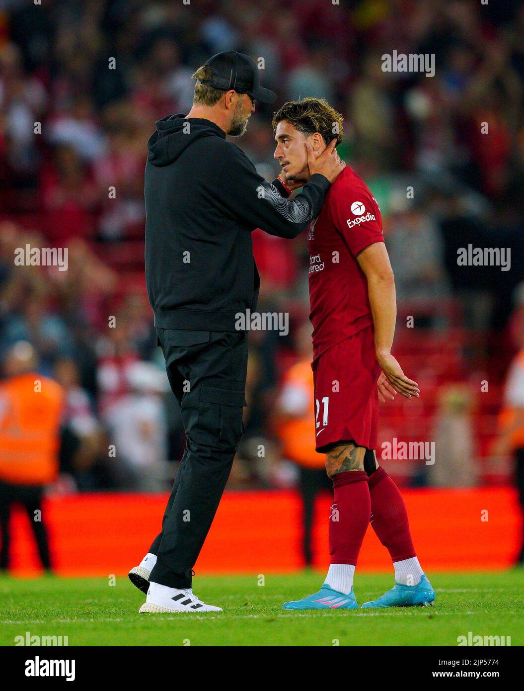 Liverpool manager Jurgen Klopp (left) speaks to Kostas Tsimikas at the ...