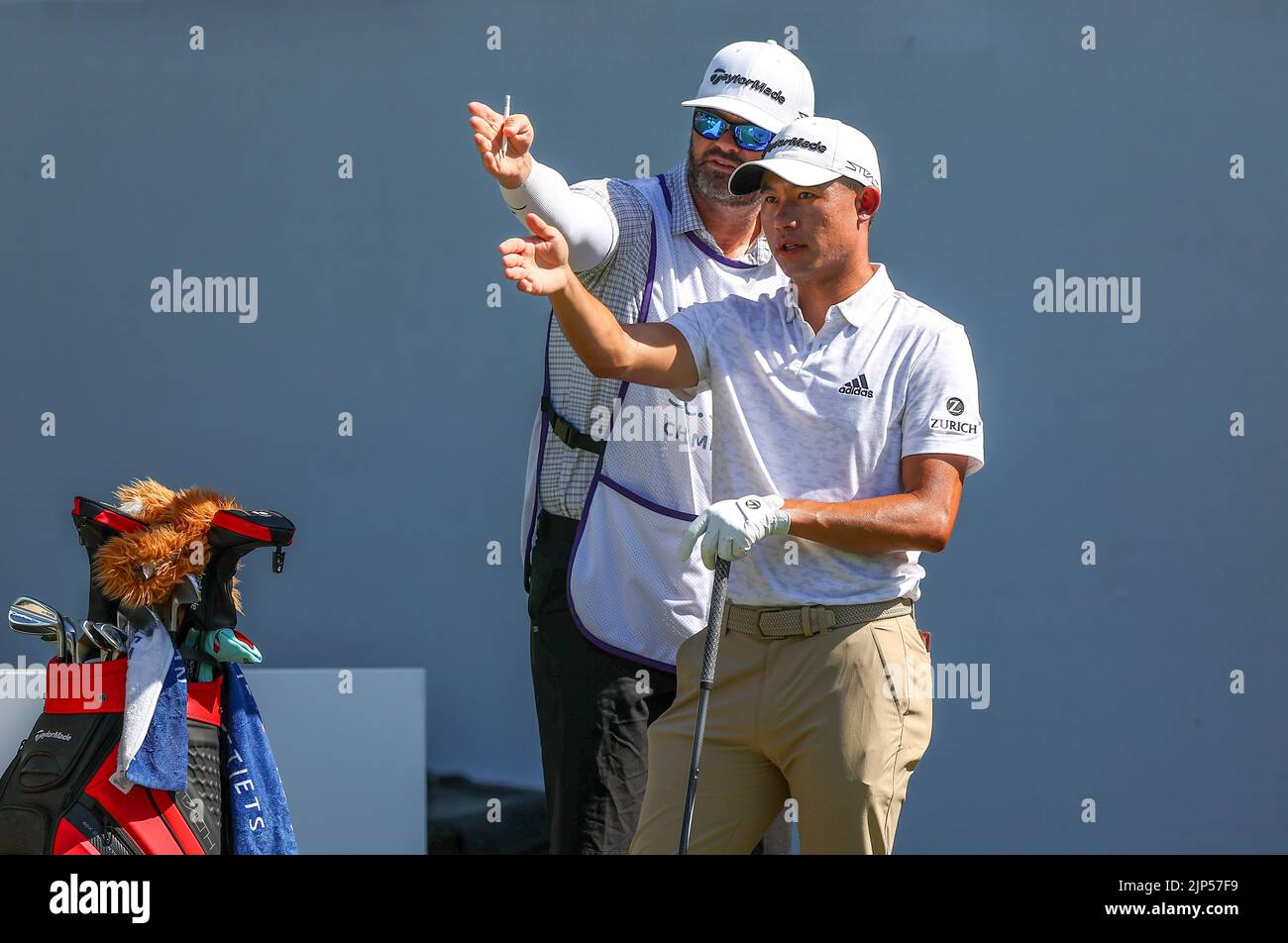 August 13, 2022: Collin Morikawa and his caddie discuss strategy on the ...