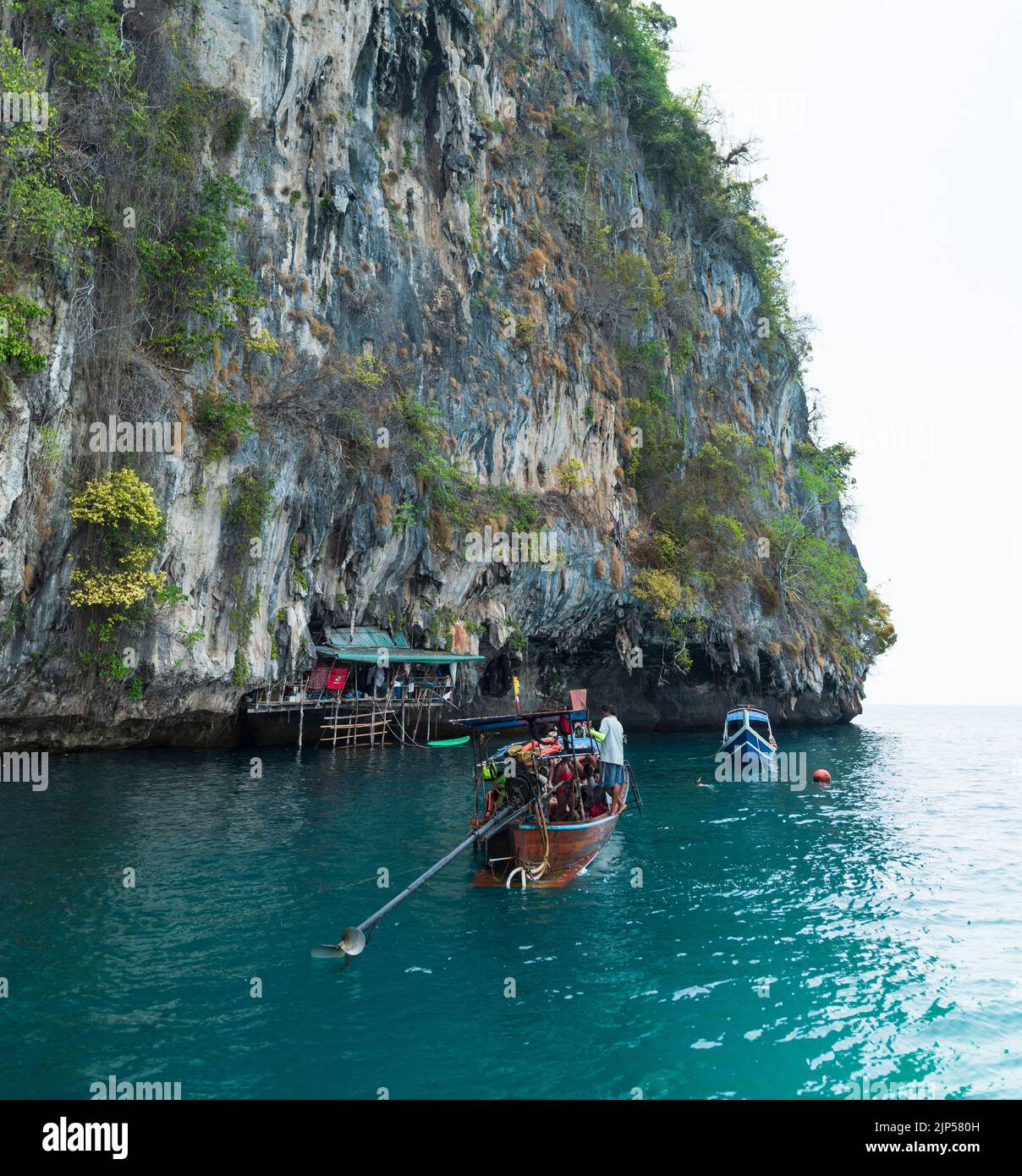 Beach on Koh Kradan Island in the Andaman Sea. House and market inside ...