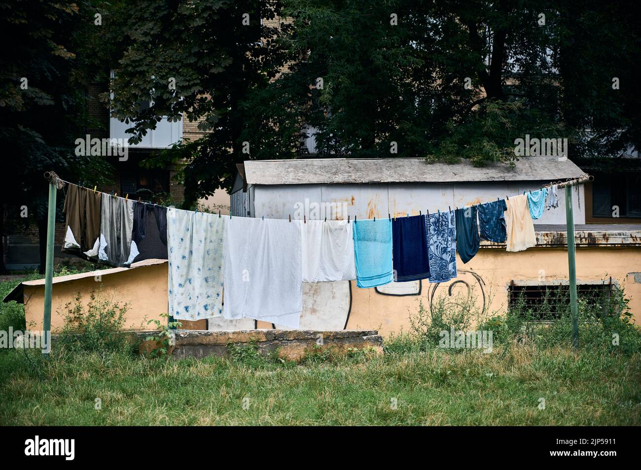 Laundry drying on the street Stock Photo - Alamy