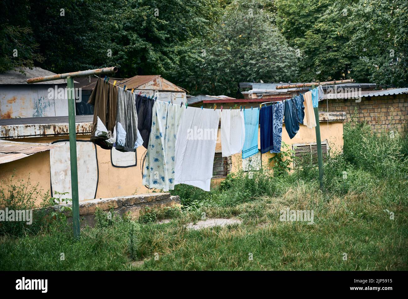 Laundry drying on the street Stock Photo - Alamy