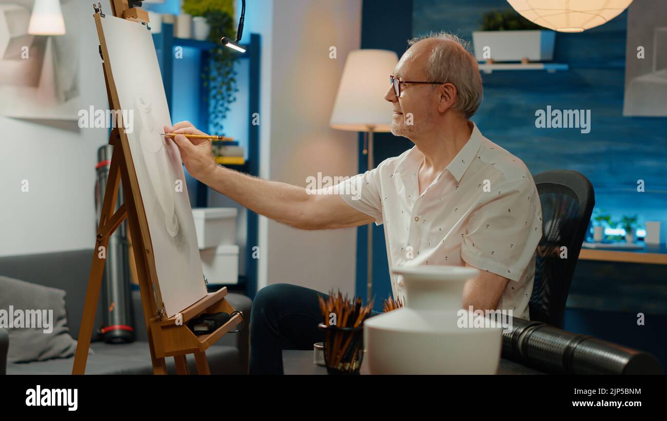 Old person using artistic skills to draw masterpiece of vase, creating ...